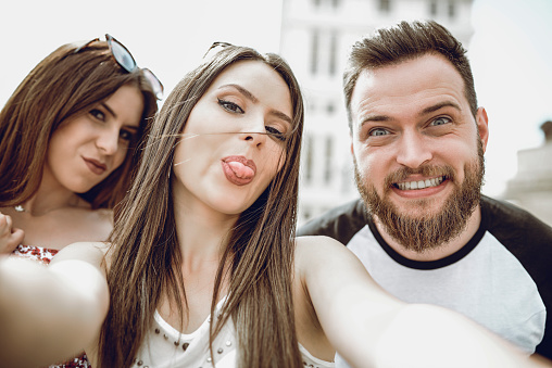 Selfie Of Crazy Friends Making Funny Faces And Having Fun Together
