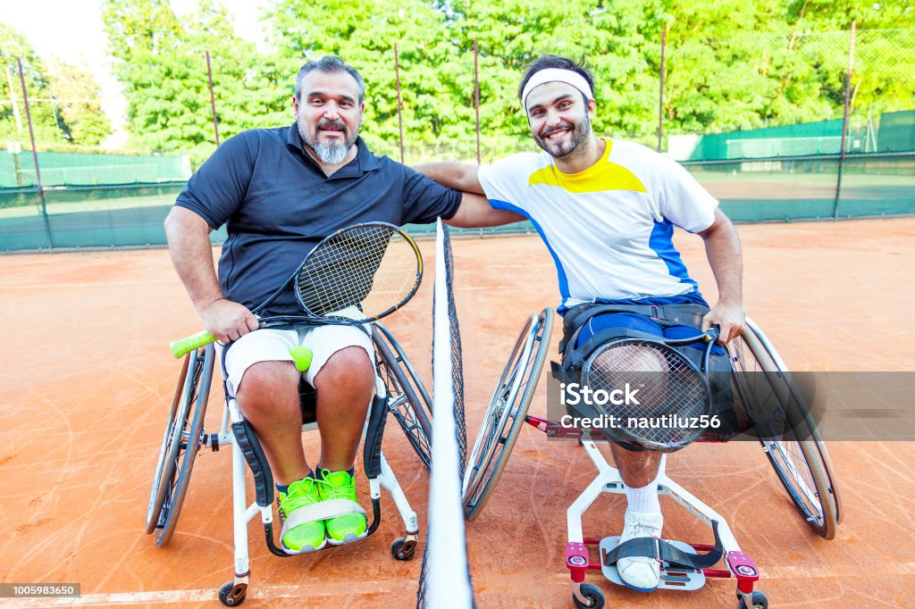 Pair Of Disabled Tennis Players Hugging Each Other Stock Photo ... Pair Of Disabled Tennis Players Hugging Each Other Stock Photo ...