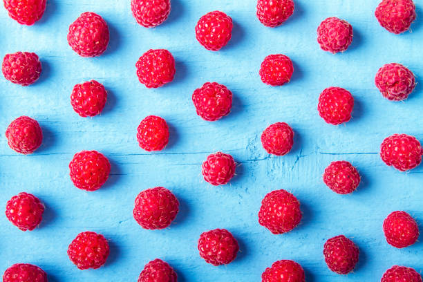 Free Stock Photo of Group of Raspberries on Blue Surface | Download ...