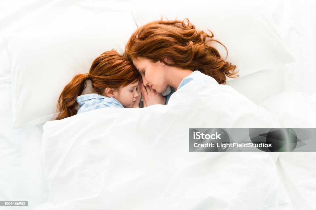Beautiful Redhead Mother And Daughter Sleeping Together In Bed Stock