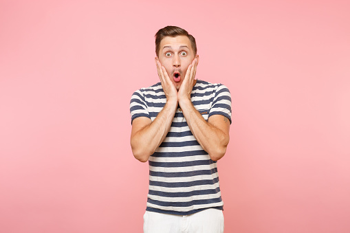 Portrait Surprised Shocked Man In Striped Tshirt Put Hands On Face