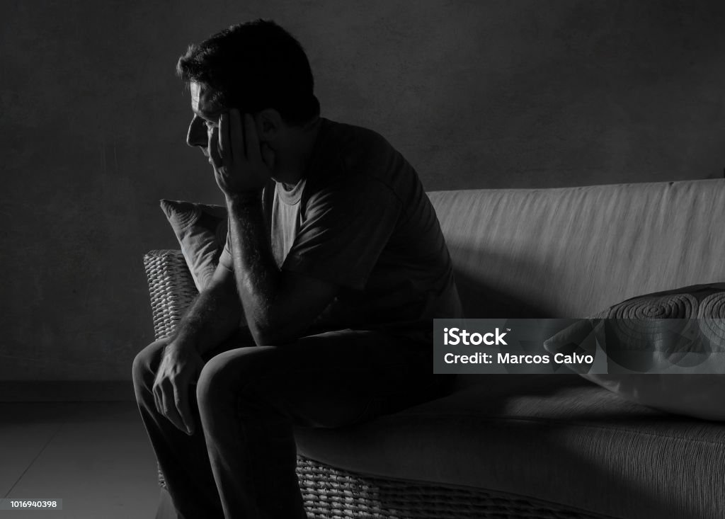 Lifestyle Dramatic Light Portrait Of Young Sad And Depressed Man