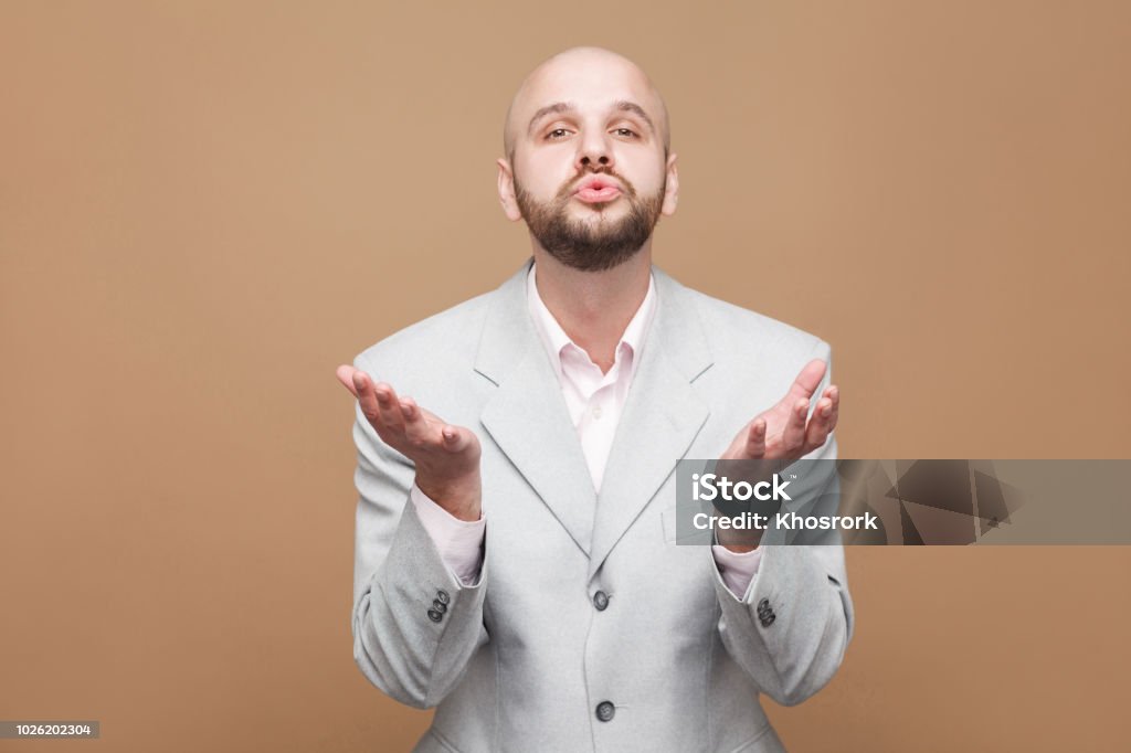 Portrait Of Happy Handsome Middle Aged Bald Bearded Businessman In