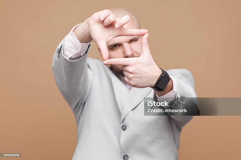 Portrait Of Handsome Middle Aged Bald Bearded Businessman In Classic