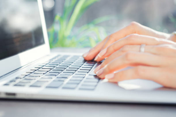 Free Stock Photo of Hands typing on laptop keyboard - fuzzy looks ...