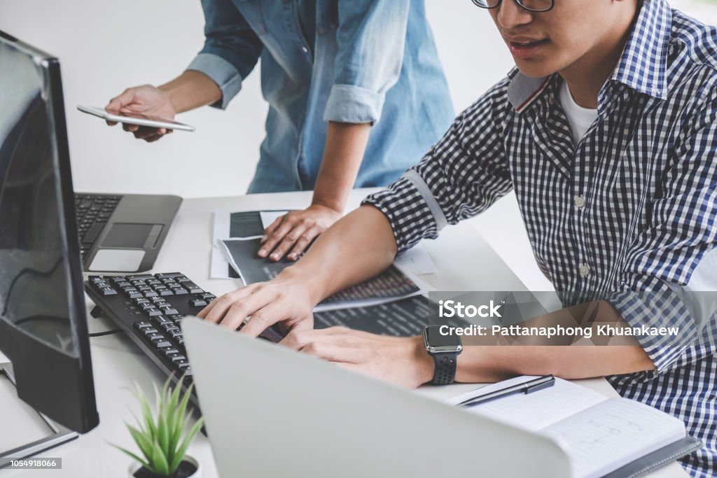 Writing Codes And Typing Data Code Technology Programmer Cooperating Working On Web Site Project