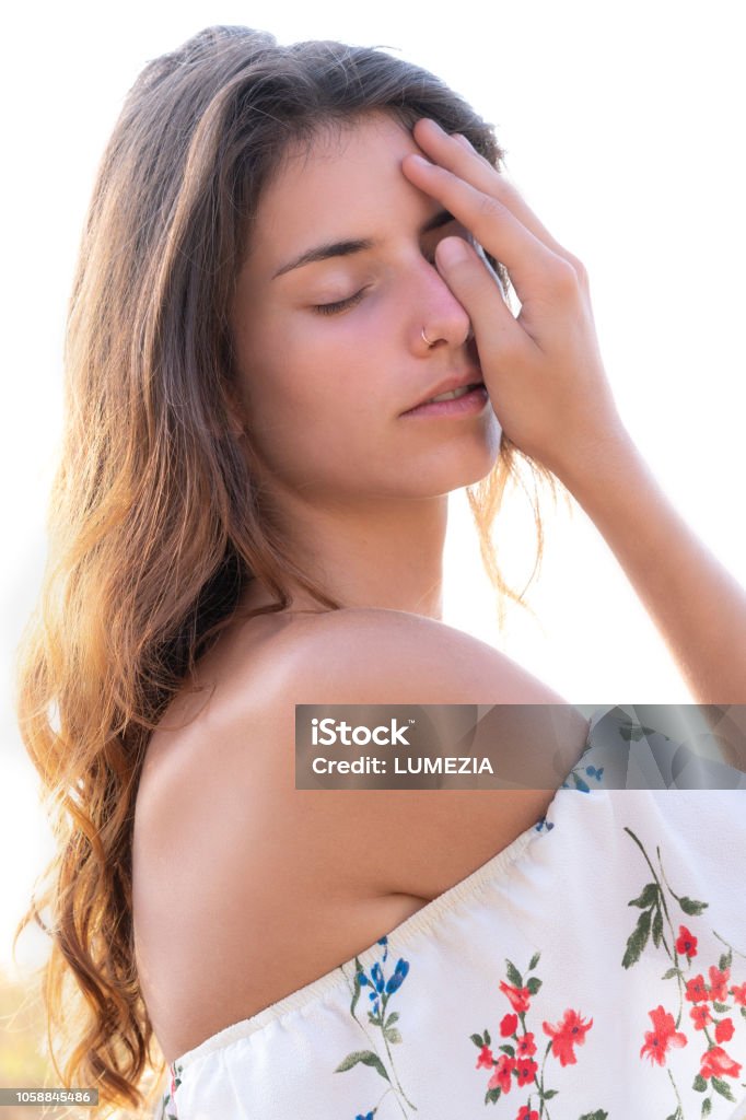 Portrait Of A Beautiful Girl With Bare Shoulders And Closed Eyes Gently