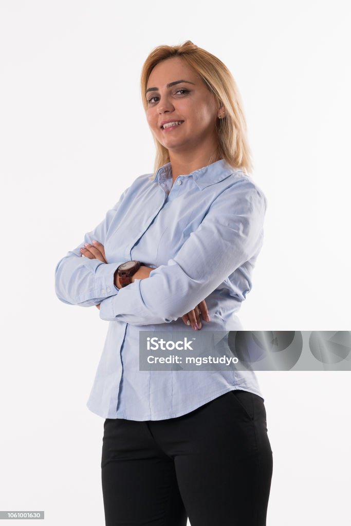 Portrait Of Smiling Business Woman With Folded Hands Isolated On White