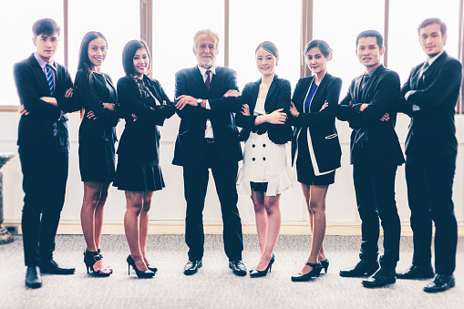Smiling Happy Businessman And Businesswomen Celebrating Success