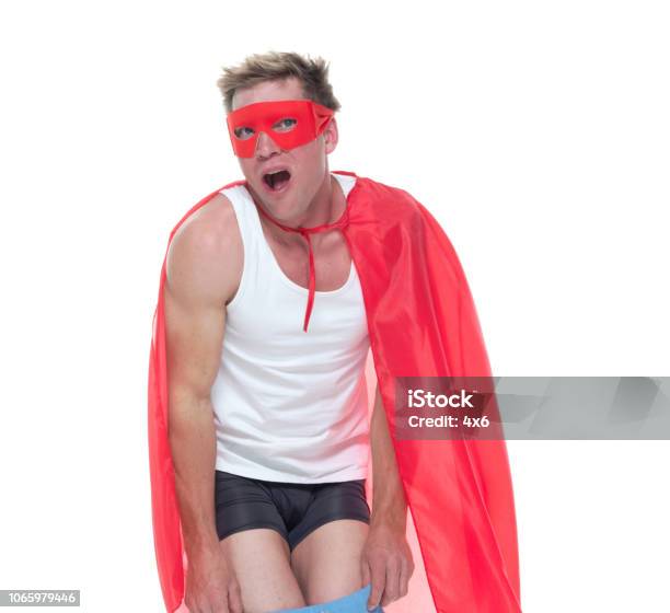 Man In Casual Clothes With Super Hero Cape Is Caught With His Pants