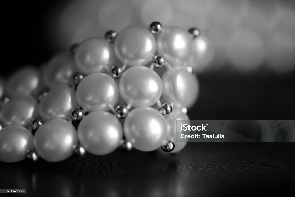 White Pearl Necklace On A Dark Background Close Up Black And White