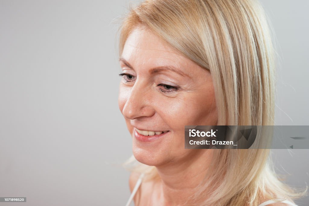 Portrait Of Beautiful Blonde Mature 55 Year Old Woman With Perfect