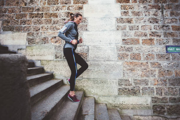Free picture: A woman climbing a stone arched staircase above a window ...