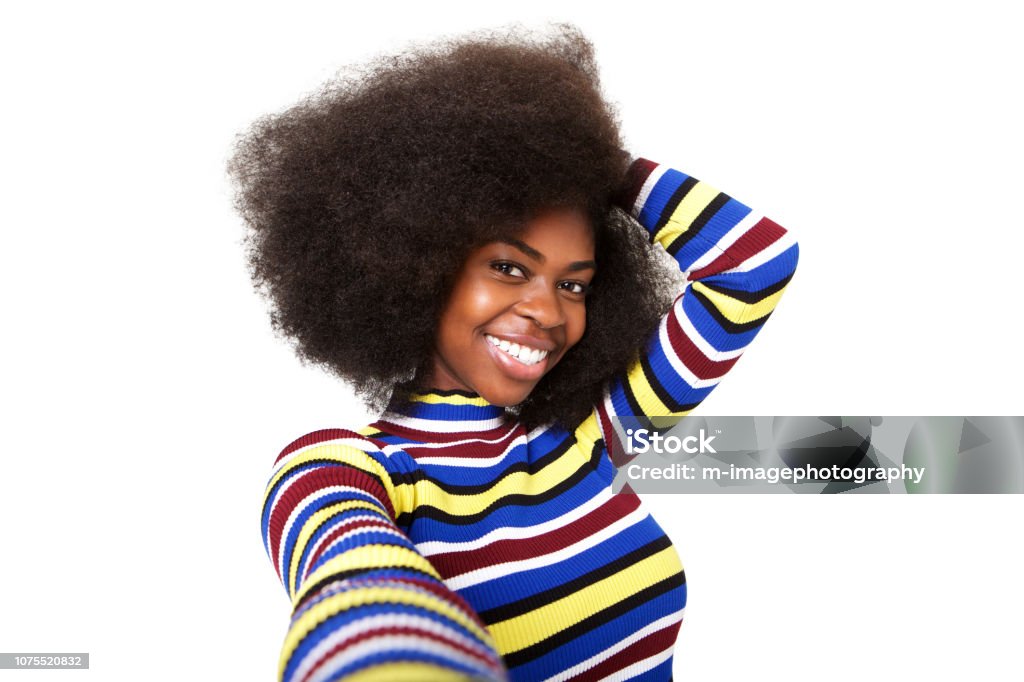 Close Up Smiling Young Black Woman Taking Selfie Against Isolated White