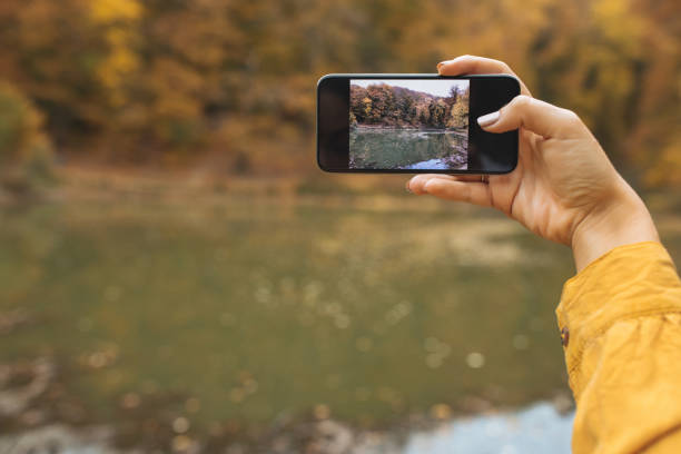 Free Stock Photo of Hand holding a smartphone capturing landscape ...