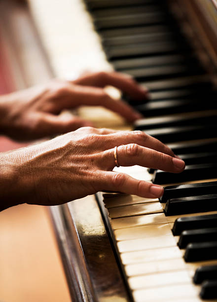 Black Hands Playing Piano