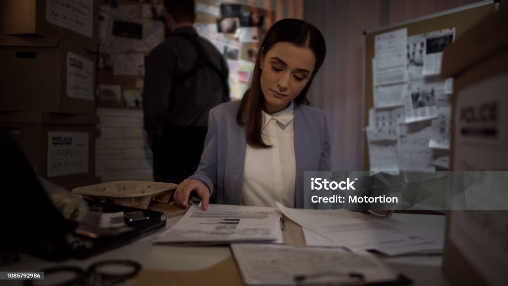 Lady Cop With Coffee Examining Case Reading Witness Statements Evidence