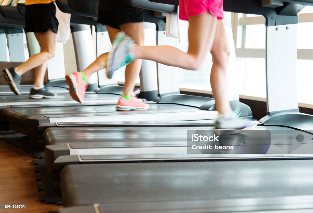 Unrecognizable People Running On Treadmills Stock Photo - Download ... Unrecognizable People Running On Treadmills Stock Photo - Download ...