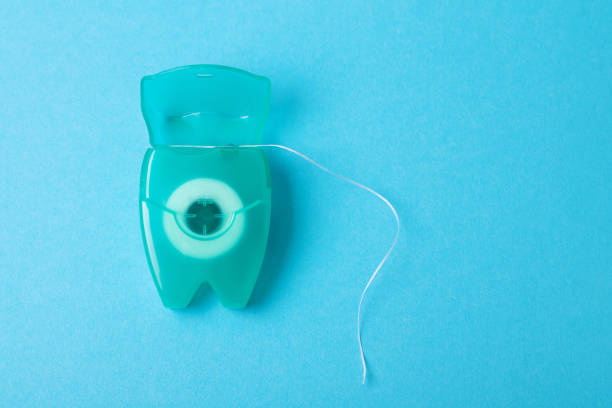 Free Stock Photo of Red floss device on a gray background | Download ...