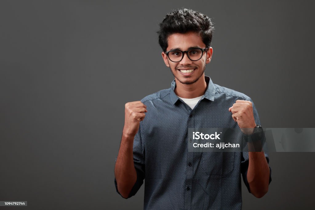 Portrait Of A Cheering Young Man Stock Photo - Download Image Now ... Portrait Of A Cheering Young Man Stock Photo - Download Image Now ...