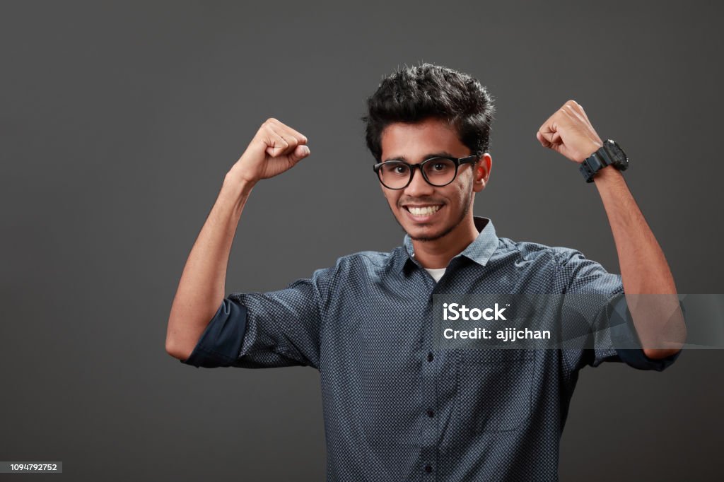 Portrait Of A Cheering Young Man Stock Photo - Download Image Now ... Portrait Of A Cheering Young Man Stock Photo - Download Image Now ...