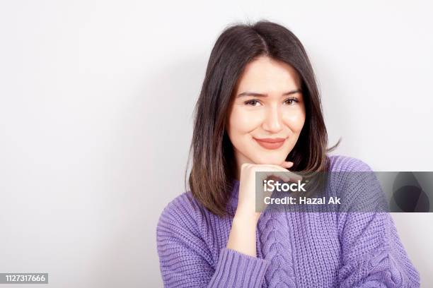 Portrait Of Young Beautiful Cute Cheerful Girl Smiling Looking At