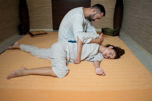 Tibetan Massage The Massage Therapist Makes A Tibetan Massage To A