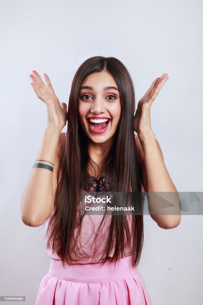 Beautiful Brunette Woman Surprise Showing Product Presenting Your