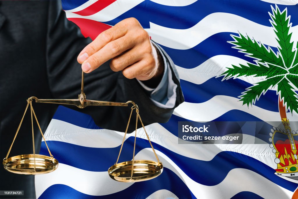 Judge Is Holding Golden Scales Of Justice With British Indian Ocean