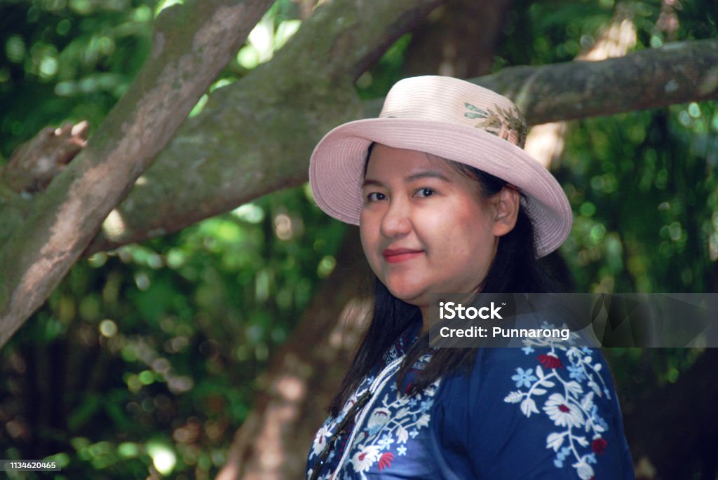 Beautiful Woman Smile Portrait And Traveling In The Forest Thailand