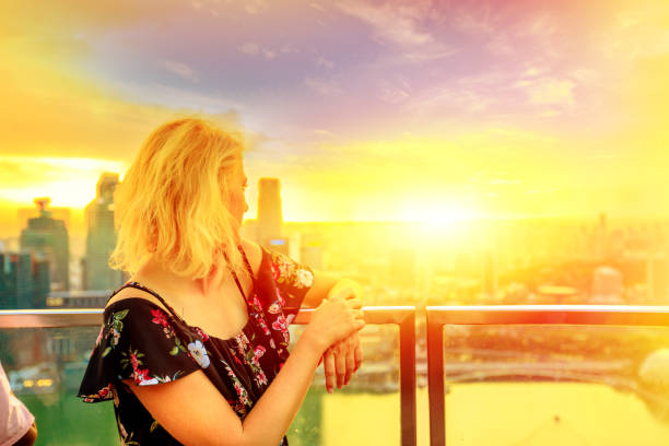 Free Stock Photo of Blonde woman overlooking city skyline at dusk ...