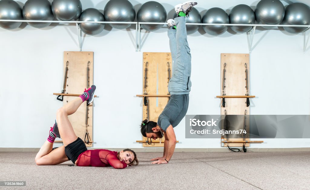 Young Healthy Yoga Fitness Acrobatic Couple Having Fun In The Gym ... Young Healthy Yoga Fitness Acrobatic Couple Having Fun In The Gym ...