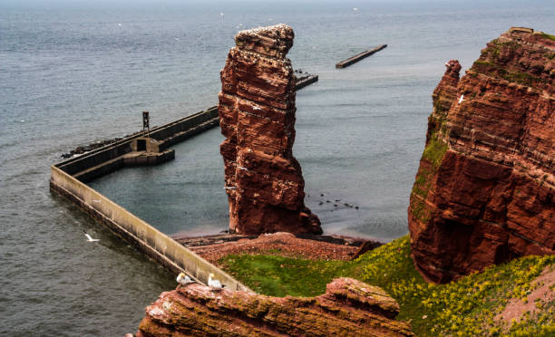 Helgoland’s Towering Rock Formations And Pier – Free Stock Photo