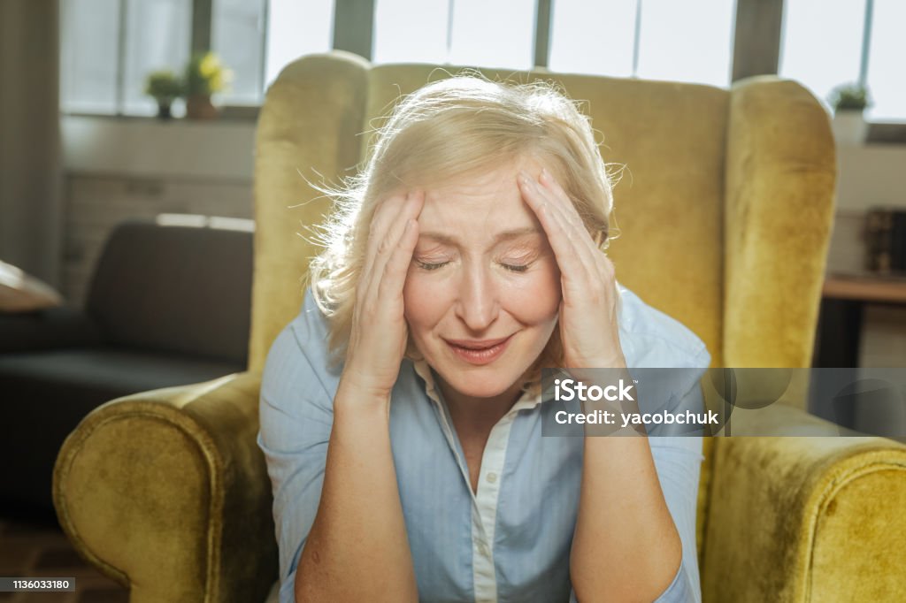 Shorthaired Blonde Woman Having Problems And Being In Tragic State