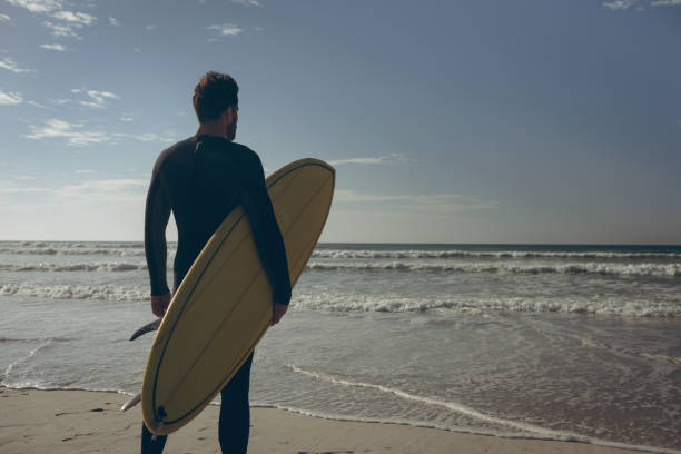 Free Stock Photo of Backside view of man with surfboard and ocean ...