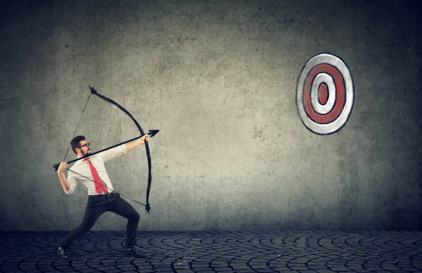 Free Stock Photo of Man Holding Bow and Arrow in Front of Target ...