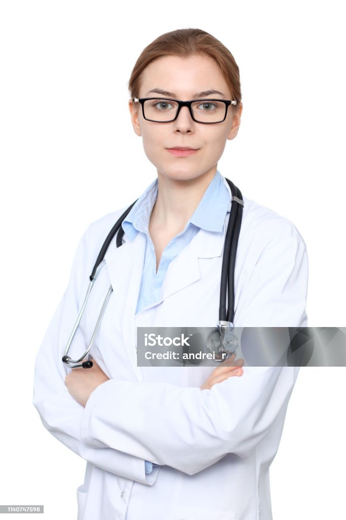 Young Brunette Female Doctor Standing With Arms Crossed Isolated Over