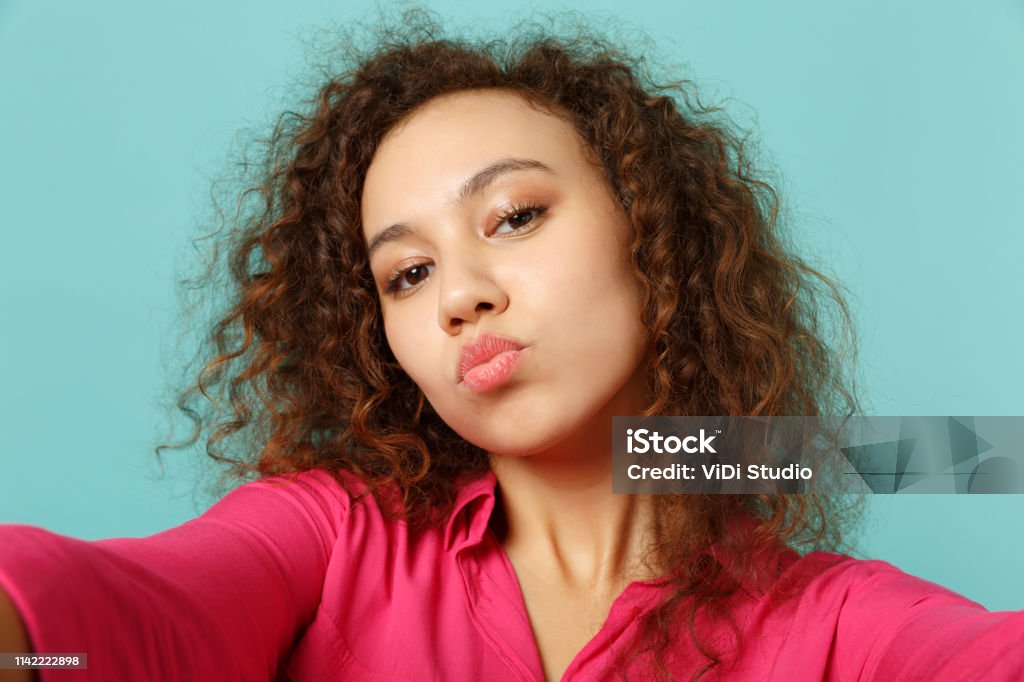 Close Up Selfie Shot Of Tender African Girl In Casual Clothes Blowing