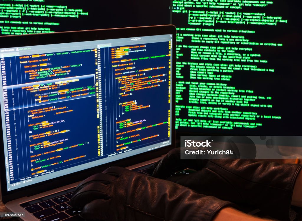 Hacking Of Database With Admin Access Side View Of Hacker Hands In Gloves Typing Malicious Code