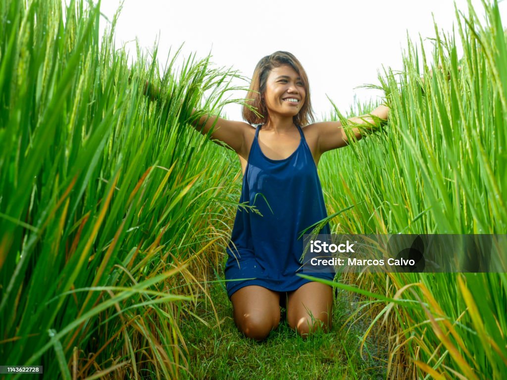 Natural And Fresh Portrait Of Young Happy And Exotic Islander Asian