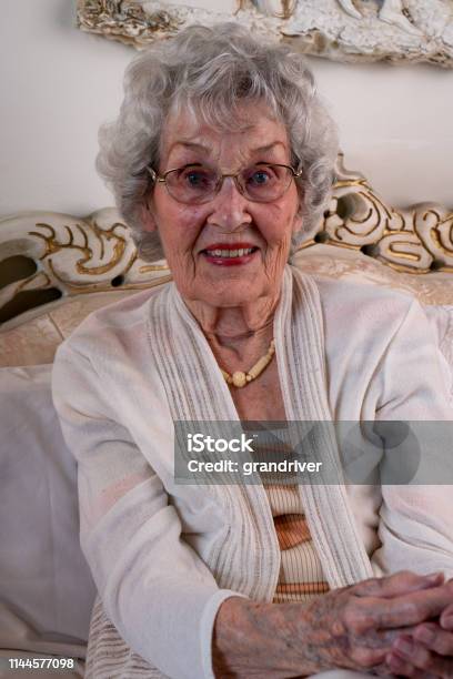 100year Old Woman Having A Cheerful Conversation In Her Home Stock