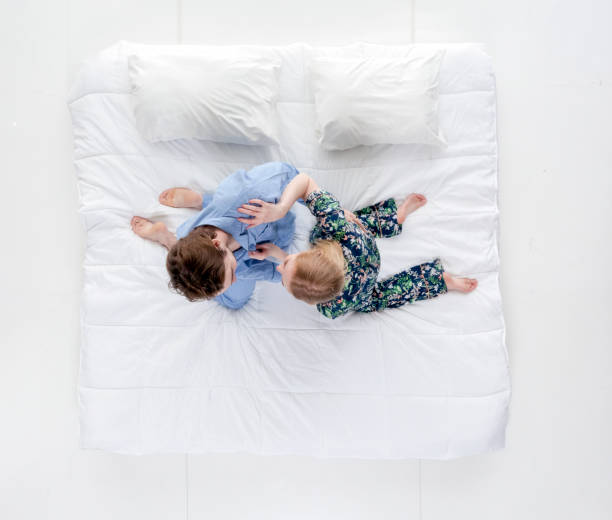 270 Best Friends Laughing On A Bed And Tickling Each Other Stock