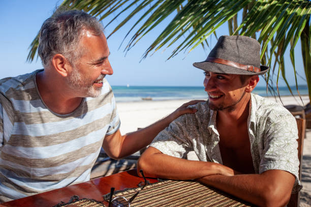 40 Mature Older Senior Gay Male Couple Smiling And Affectionate Stock