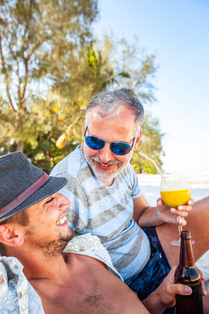 40 Mature Older Senior Gay Male Couple Smiling And Affectionate Stock