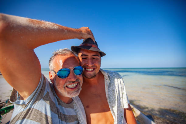 40 Mature Older Senior Gay Male Couple Smiling And Affectionate Stock