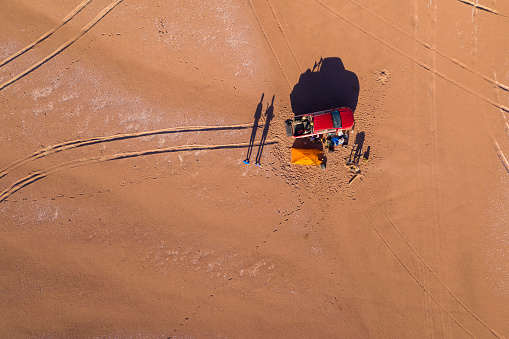 Aerial Overhead View A Stop In The Desert Campsite With A Tent Fire And