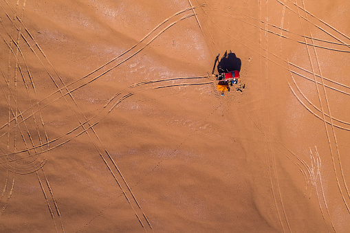 Aerial Overhead View A Stop In The Desert Campsite With A Tent Fire And