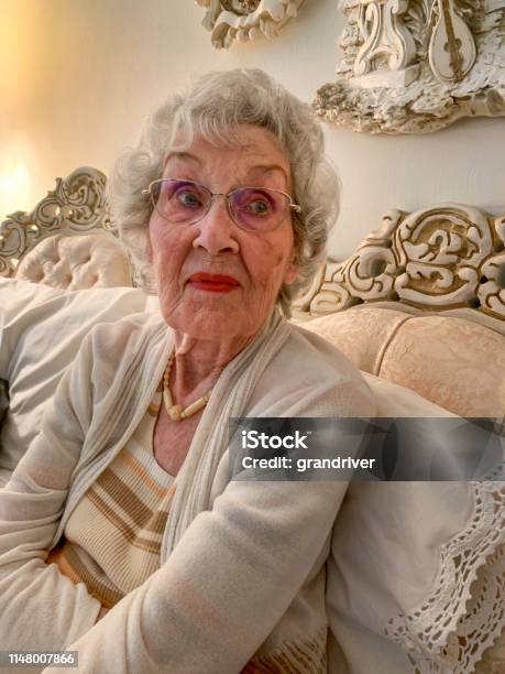 100year Old Woman Having A Cheerful Conversation In Her Home Stock