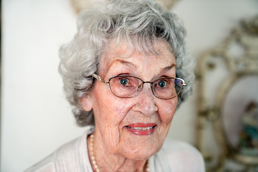 100year Old Woman Having A Cheerful Conversation In Her Home Stock