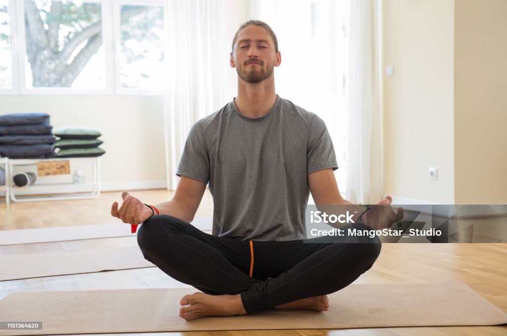 Man Meditating And Holding Hands In Mudra Gesture In Class Stock Photo ... Man Meditating And Holding Hands In Mudra Gesture In Class Stock Photo ...